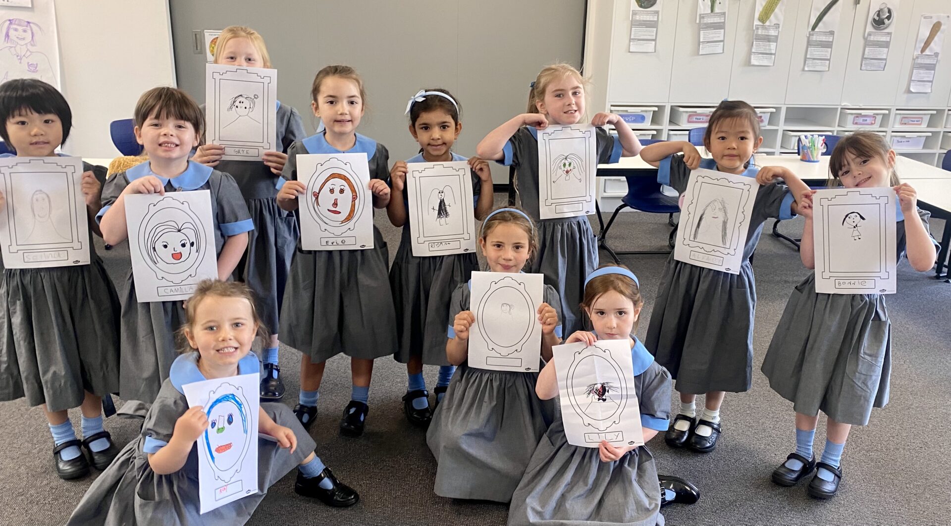Prep students displaying their self portraits - St Catherine's School